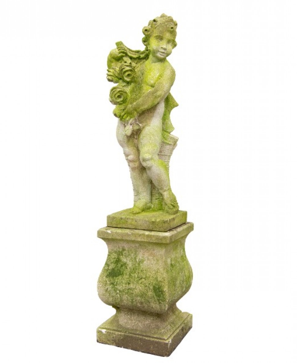 Concrete statue of cherub holding roses on base